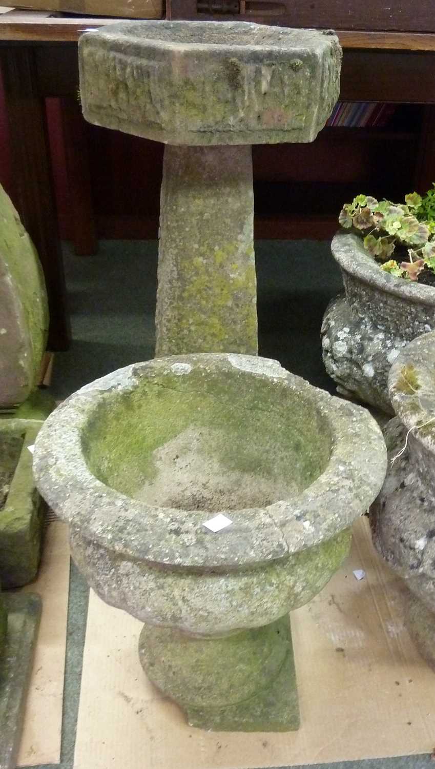 Lot 9 - A reconstituted stone bird bath, 77cm high and