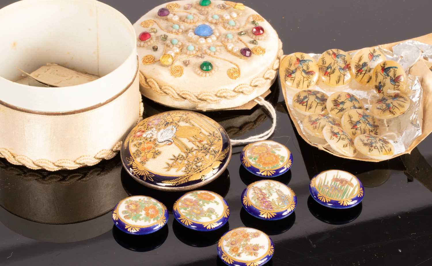 Lot 409 - Eight Japanese Meji period buttons, 5cm and